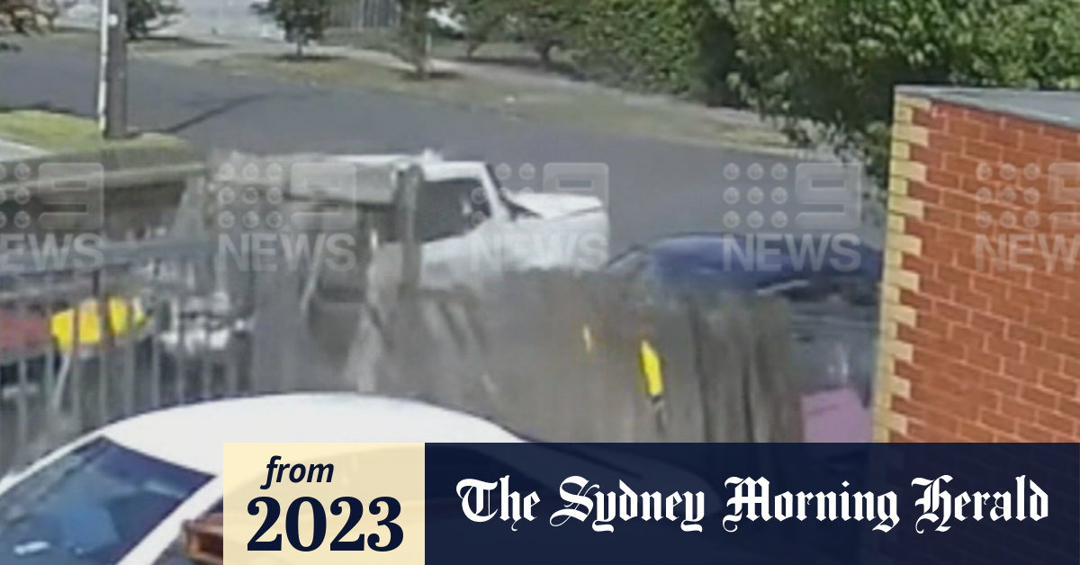 Video: CCTV captures moment car crashes through fence and hits parked car