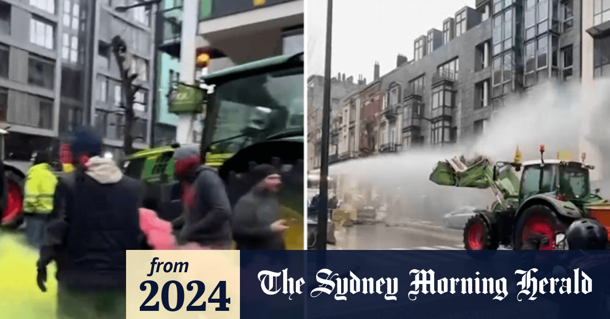 Video: Police sprayed with liquid manure at EU farmers' protest