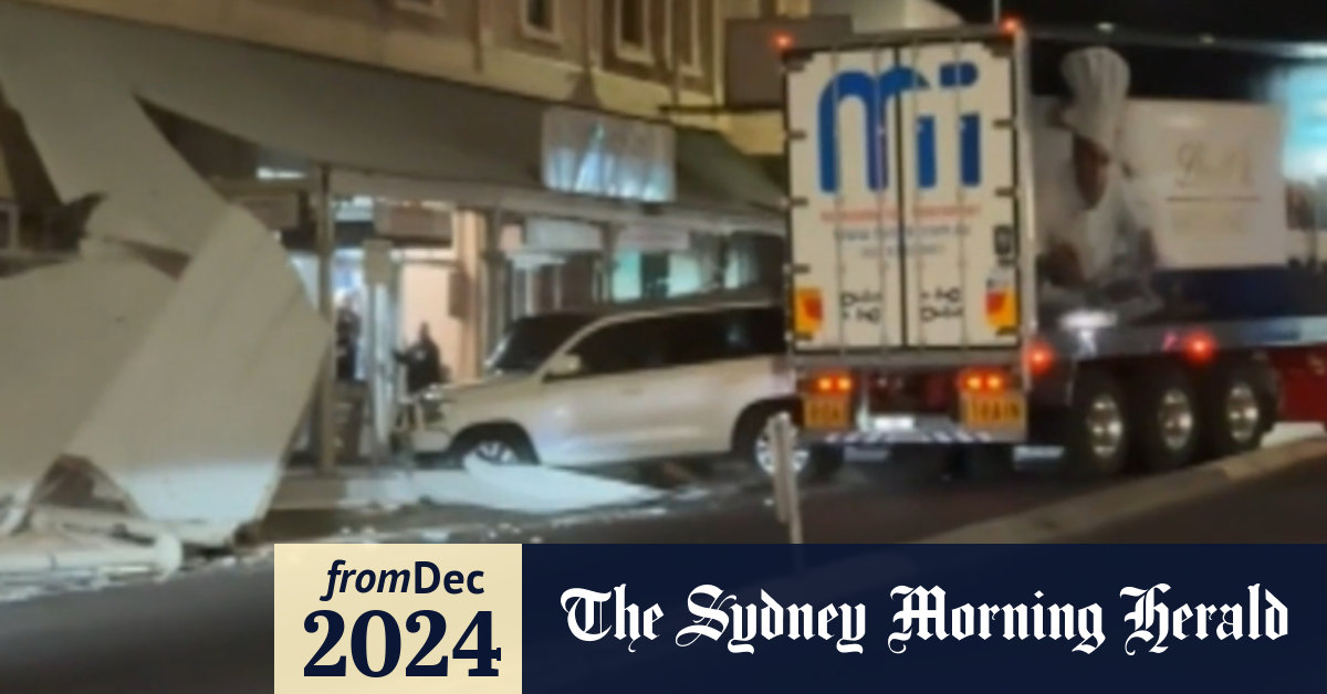 Video: Road train driver charged after allegedly smashing through posts ...