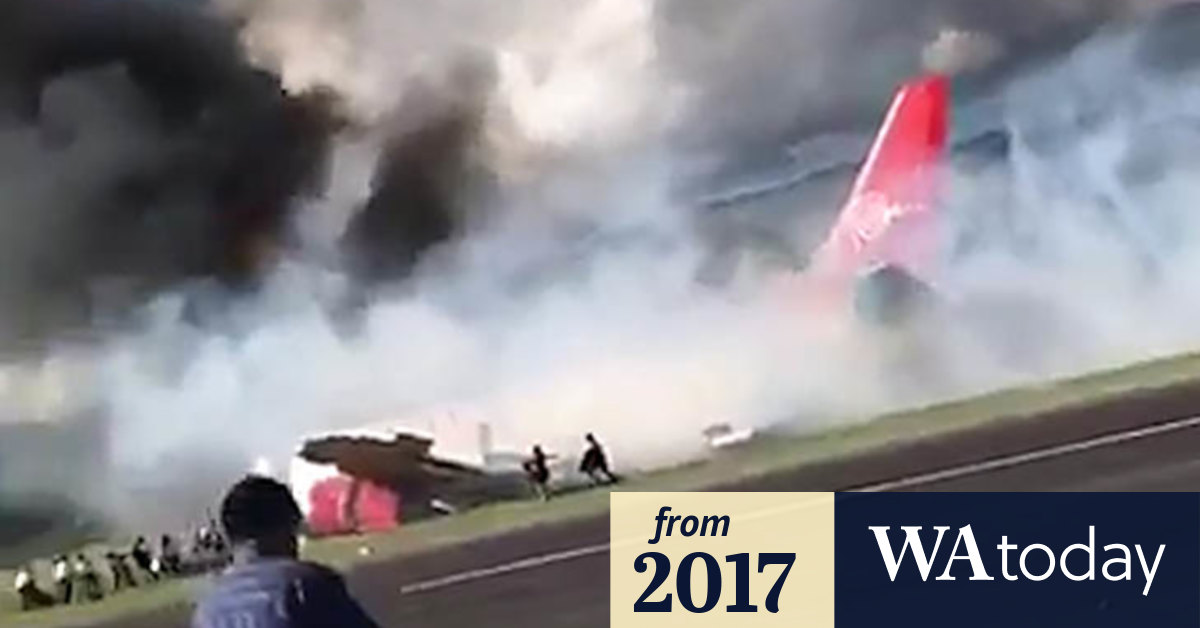 Video: Jet on fire as passengers flee