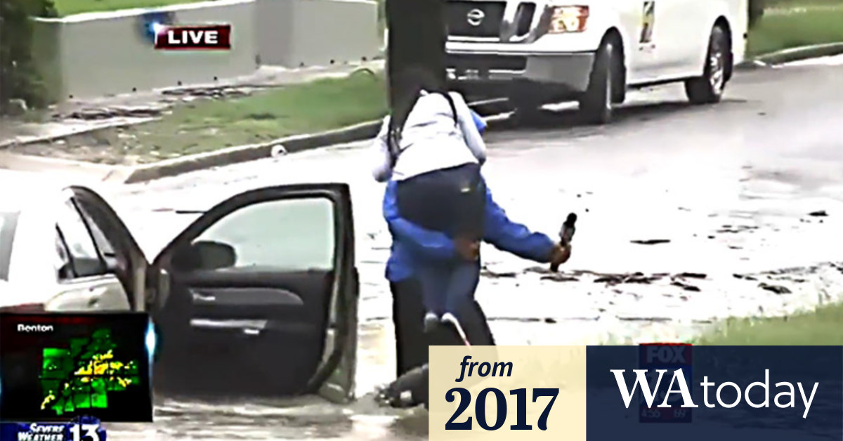 Video: TV reporter rescues woman from flood