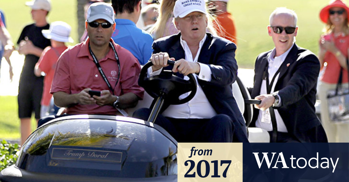 Video: Trump drives golf cart onto green