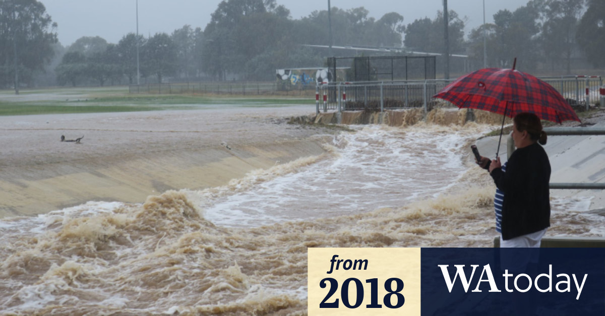 Canberra hit by flash flooding as storm brings lots of rain