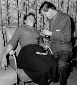 From the Archives, 1957: Police escort Johnnie Ray from stadium