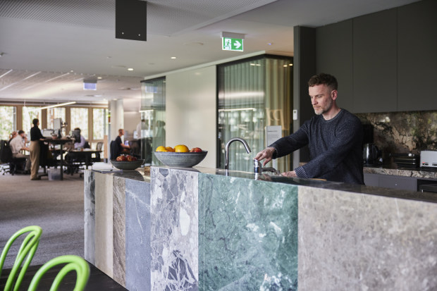 Arup office uses recycled timber and salvaged counter tops