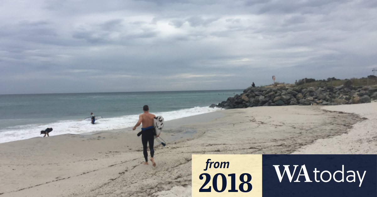 Perth surfers enjoy rare cyclone swell as shark warning issued down South