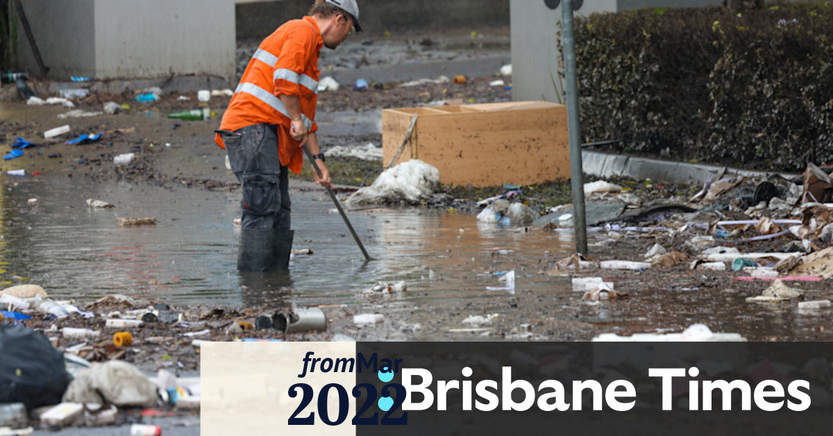 Woman found dead, mud army hits streets as flood aid announced