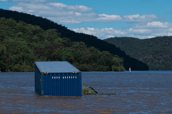Shipping containers, furniture found on beaches as flood sweeps debris ...