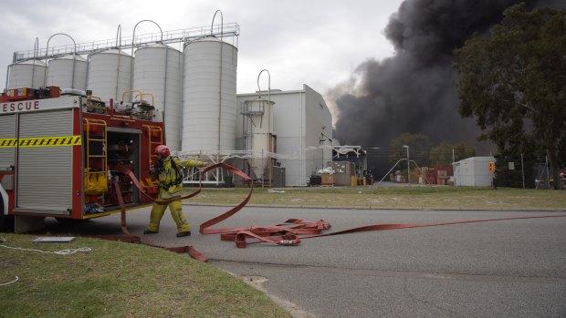 Perth factory fire contained after burning for more than 24 hours