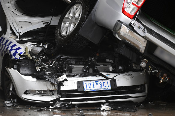 Car smashes into Reservoir police station, crushes police car