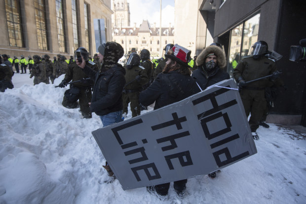Canadian police force trucker protesters out of Ottawa