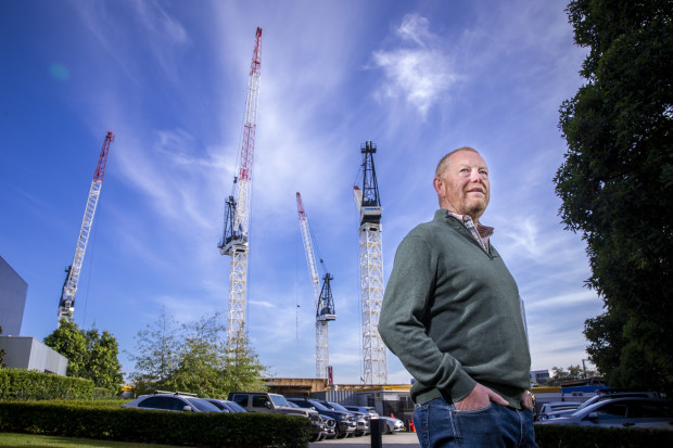 Max Beck gets back on the tools to complete Caulfield Village