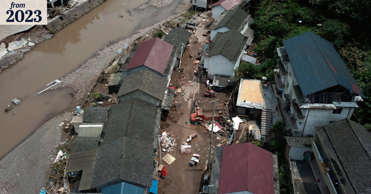 Heavy floods displace 10,000 as Beijing gets respite from extreme heat