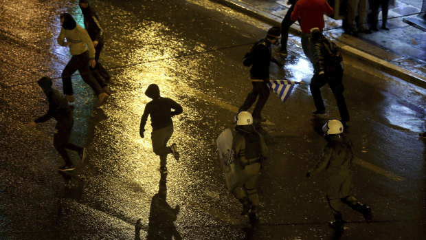 Greek police fire tear gas as thousands protest during Macedonia deal ...