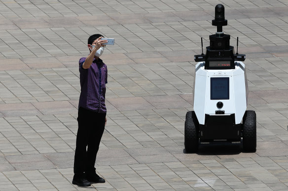Singapore deploys robots to patrol streets in new trial of COVID compliance