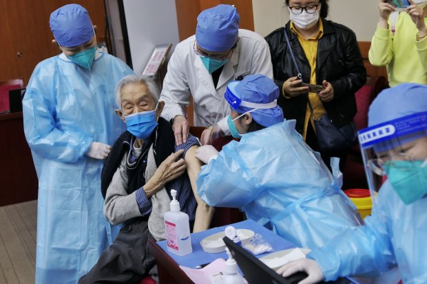 China steps up vaccination drive as protests fade