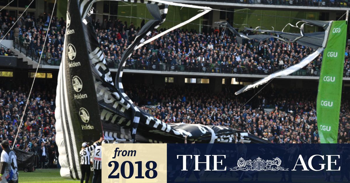 Magpie horror: Collingwood banner rips apart in wind before grand final