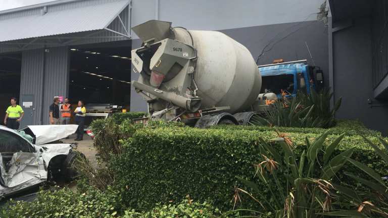 Concrete truck crashes into five cars before slamming into Brisbane factory