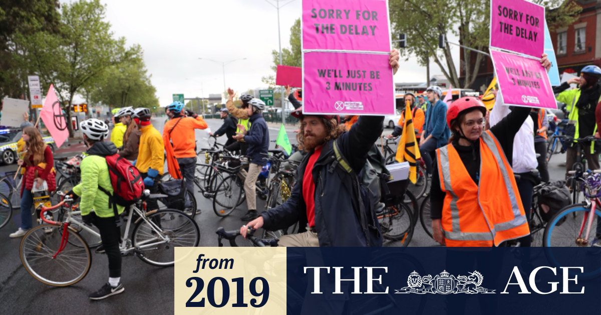 Climate activists use bikes to block morning traffic