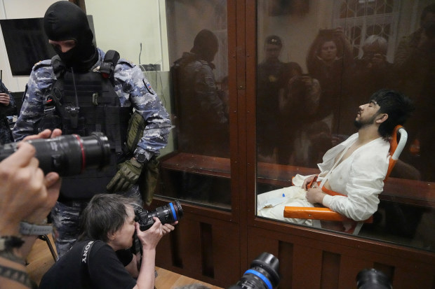 Moscow attack: ‘Tortured’ suspects appear in court as Russia mourns