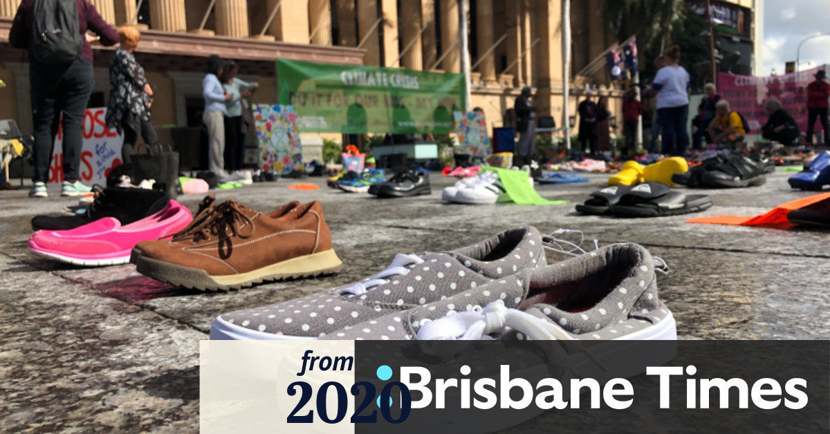 Hundreds of children's shoes laid out in silent Brisbane climate protest