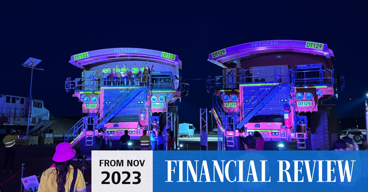 Gina Rinehart handholds Peter Dutton at neon bush doof