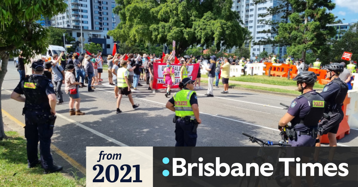 Vaccine supporters have a jab at anti-vax protesters at Brisbane rally