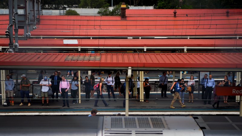 Redfern station police operation forces train delays for Sydney commuters