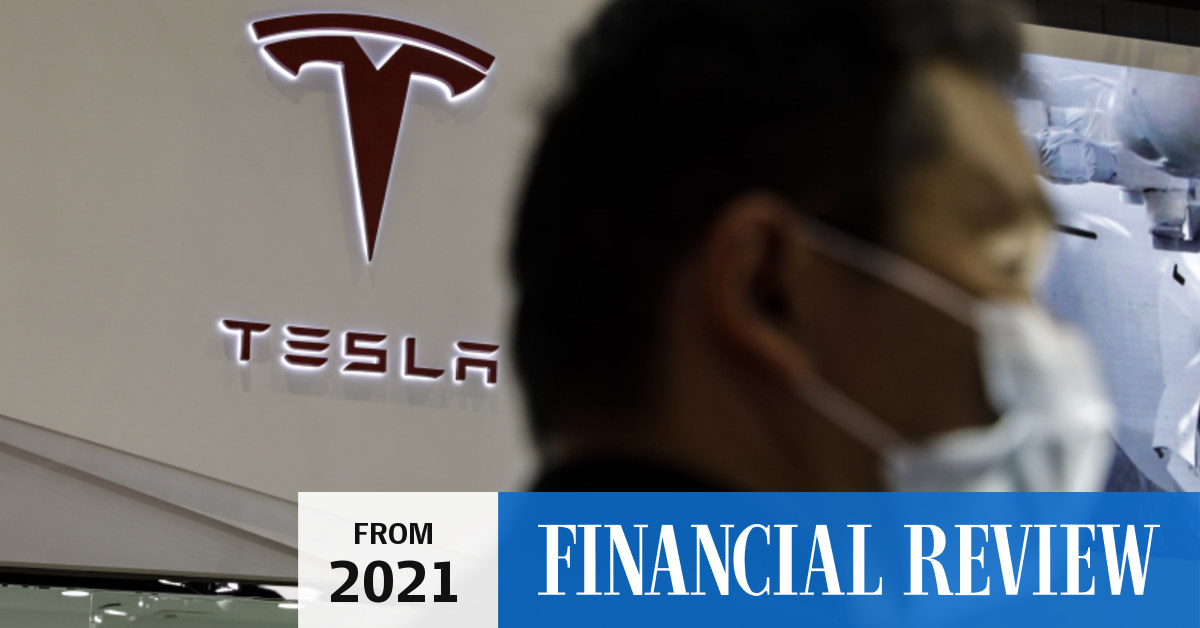 Angry Tesla owner jumps atop a Model 3 at Shanghai Auto show in protest ...