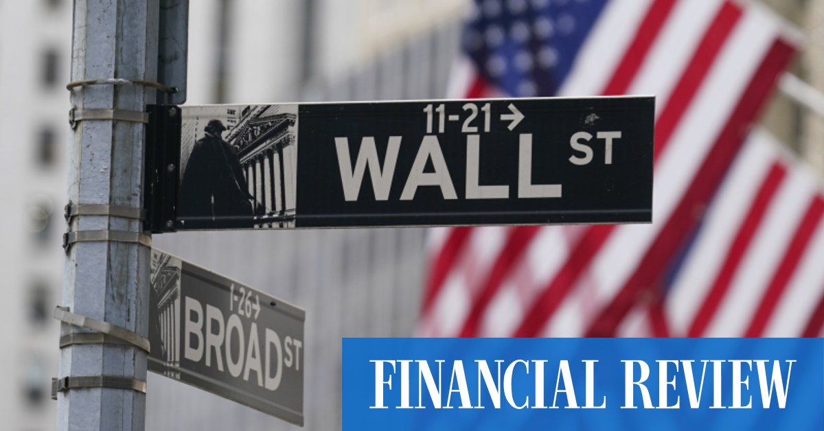 Wall St tumbles as Fed reaffirms higher rate path