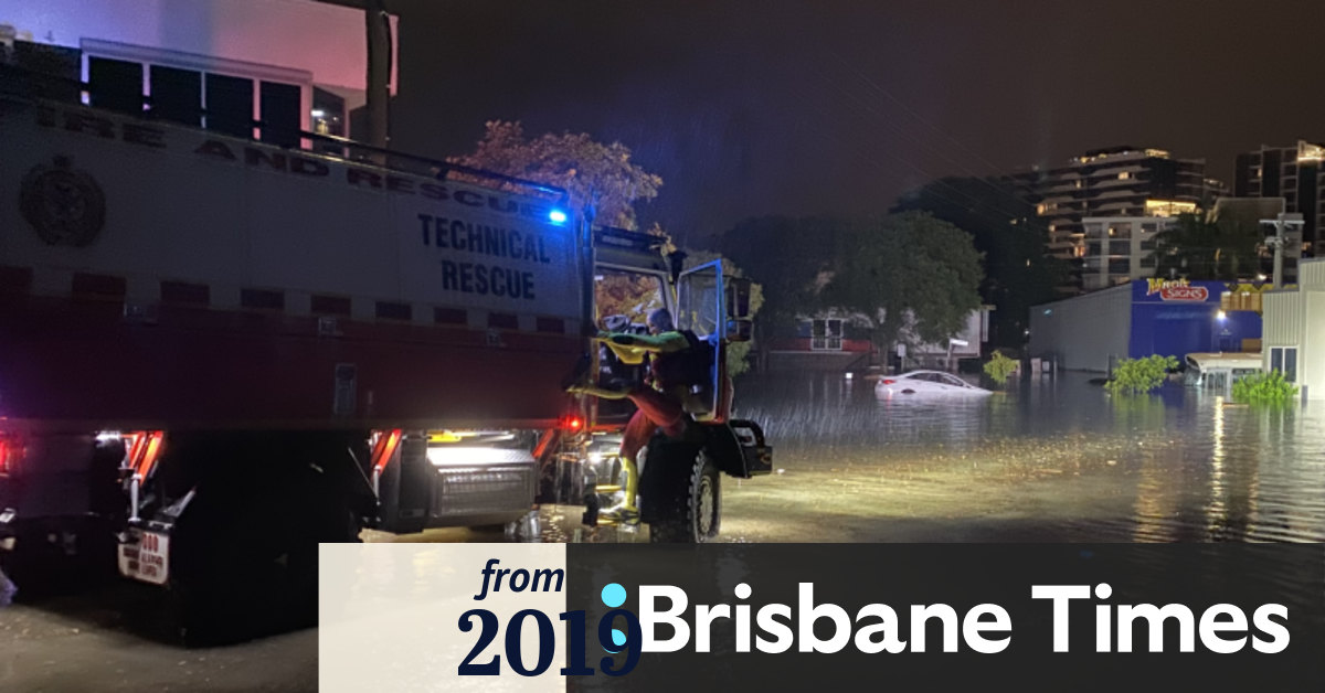 Brisbane storms smash rain record, float cars in flooded inner-city streets