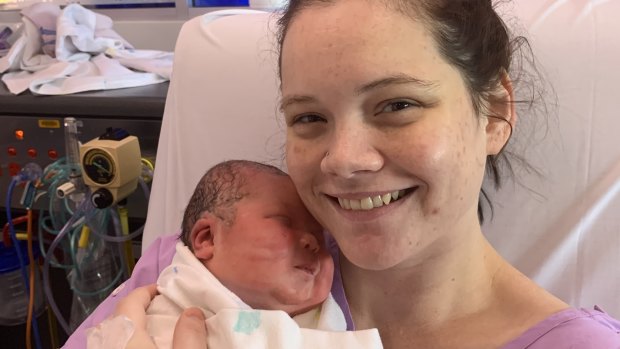 High-school sweethearts welcome their New Year's Day baby into the world
