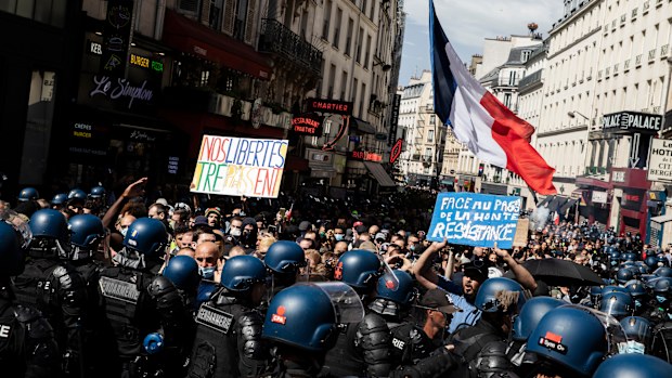 ‘We don’t want your health pass’, French protesters tell Macron