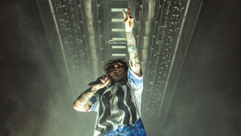 Emotional rapper Post Malone smashes up guitar before Brisbane crowd