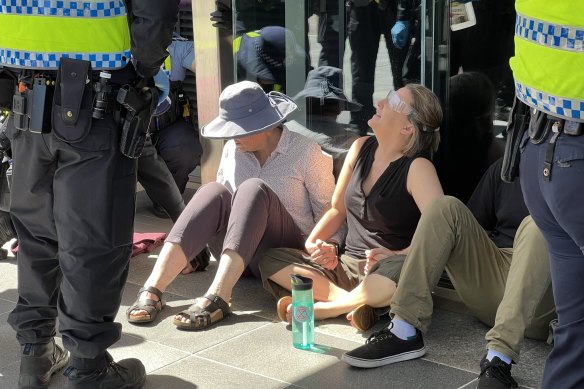 Extinction Rebellion glue hands to floor at Dumas House Perth to ...