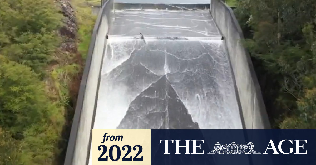 Thomson Dam spills over for first time in 26 years as rain drenches ...