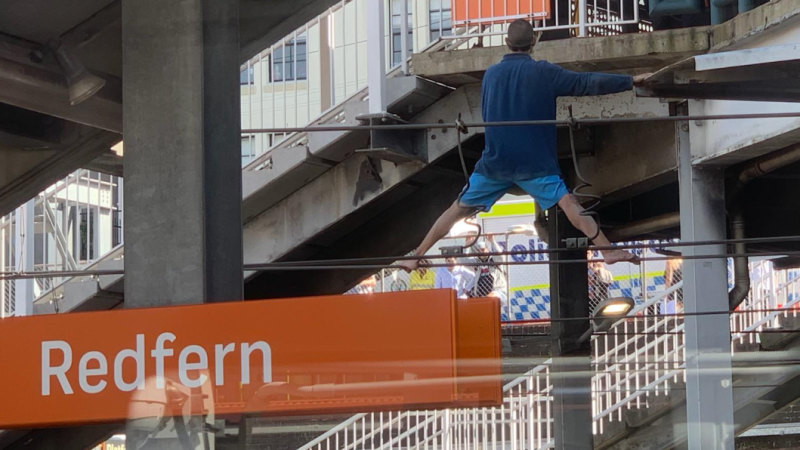 Redfern station police operation forces train delays for Sydney commuters