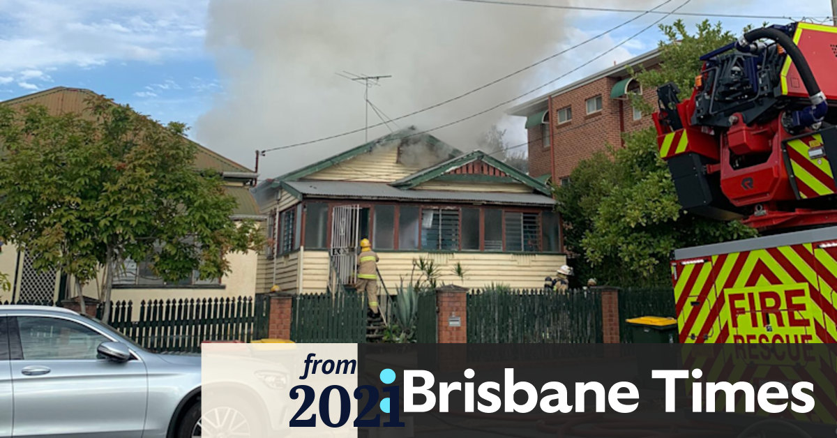Man rushed to hospital after house fire in Brisbane’s inner north
