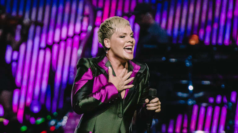 Pink sings and soars above as Brisbane crowd holds its breath