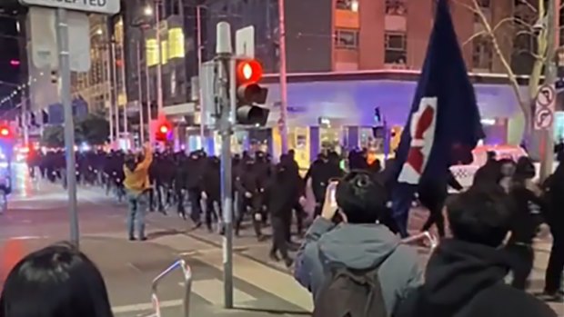 Neo-Nazis march in Melbourne CBD, given escort by police officers