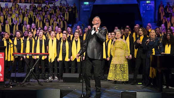 John Farnham joins Brisbane choir to sing out against domestic violence
