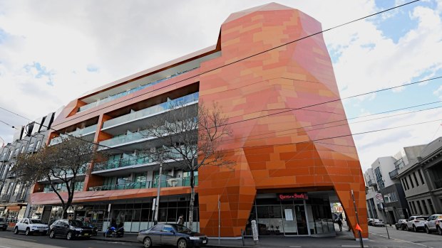 Prahran residents fear fire risk over flame-coloured facade