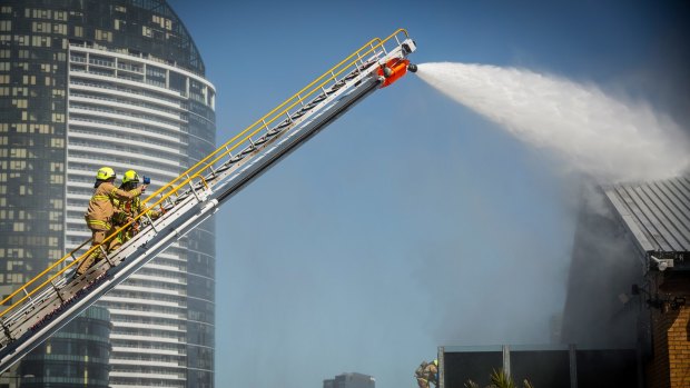 Fireys put out Docklands blaze after asbestos found in burning pub's roof