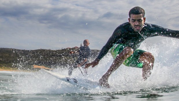 Blind surfer Derek Rabelo learns from Australian legend Tom Carroll