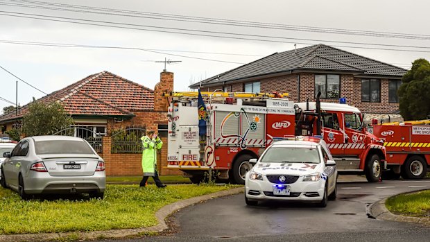 Woman dead after suspicious fire as closed shutters make rescue 'difficult'