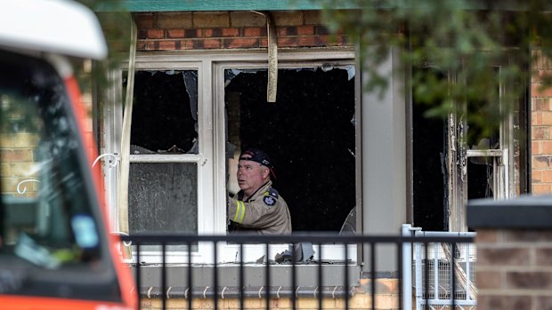 Woman dead after suspicious fire as closed shutters make rescue 'difficult'