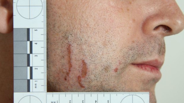 Gerard Baden-Clay demonstrates cutting face with razor