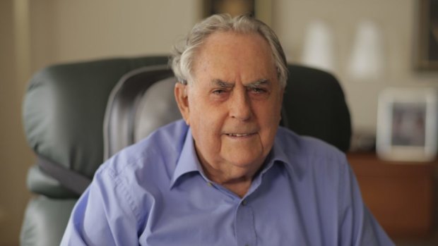 Motor racing legend Sir Jack Brabham overtakes 50 cent coin