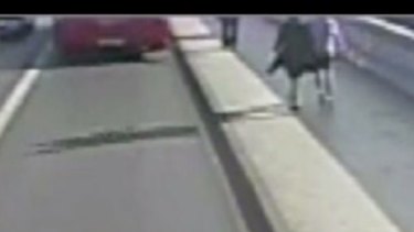 CCTV shows woman pushed in front of bus by jogger on a London bridge