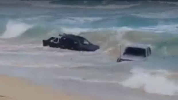 Extraordinary footage of two utes 'surfing' waves in the South West of WA